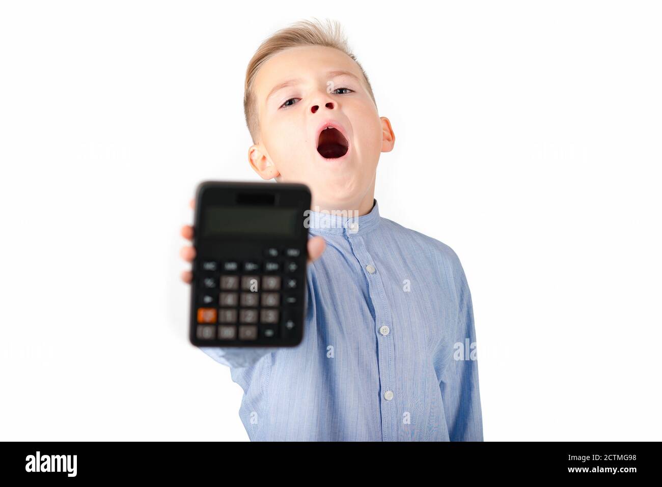 Schoolboy holding calculator. Portrait of funny cute 10s boy . tired ...