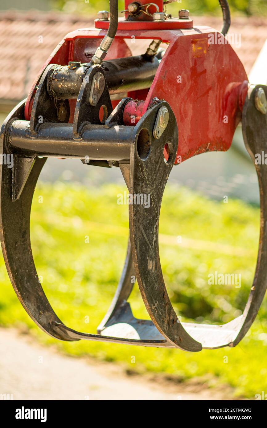 Wood tongs for the tractor in close-up Stock Photo - Alamy