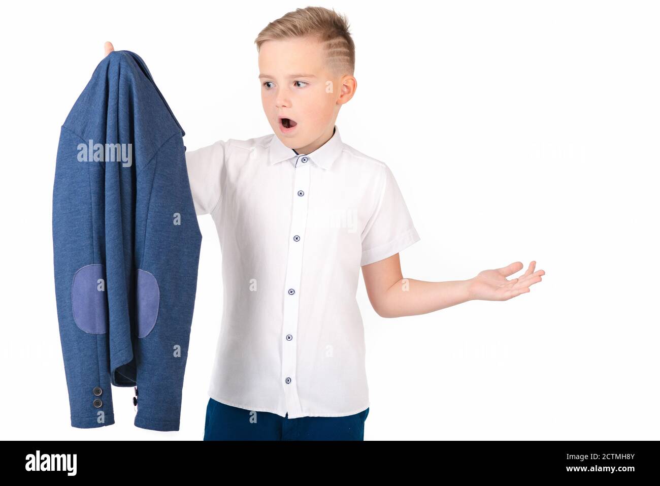 Front view portrait of disappointed student holds the school suit ...