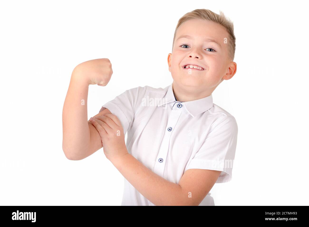 Close up image.The strong smiling caucasian school boy on a white ...