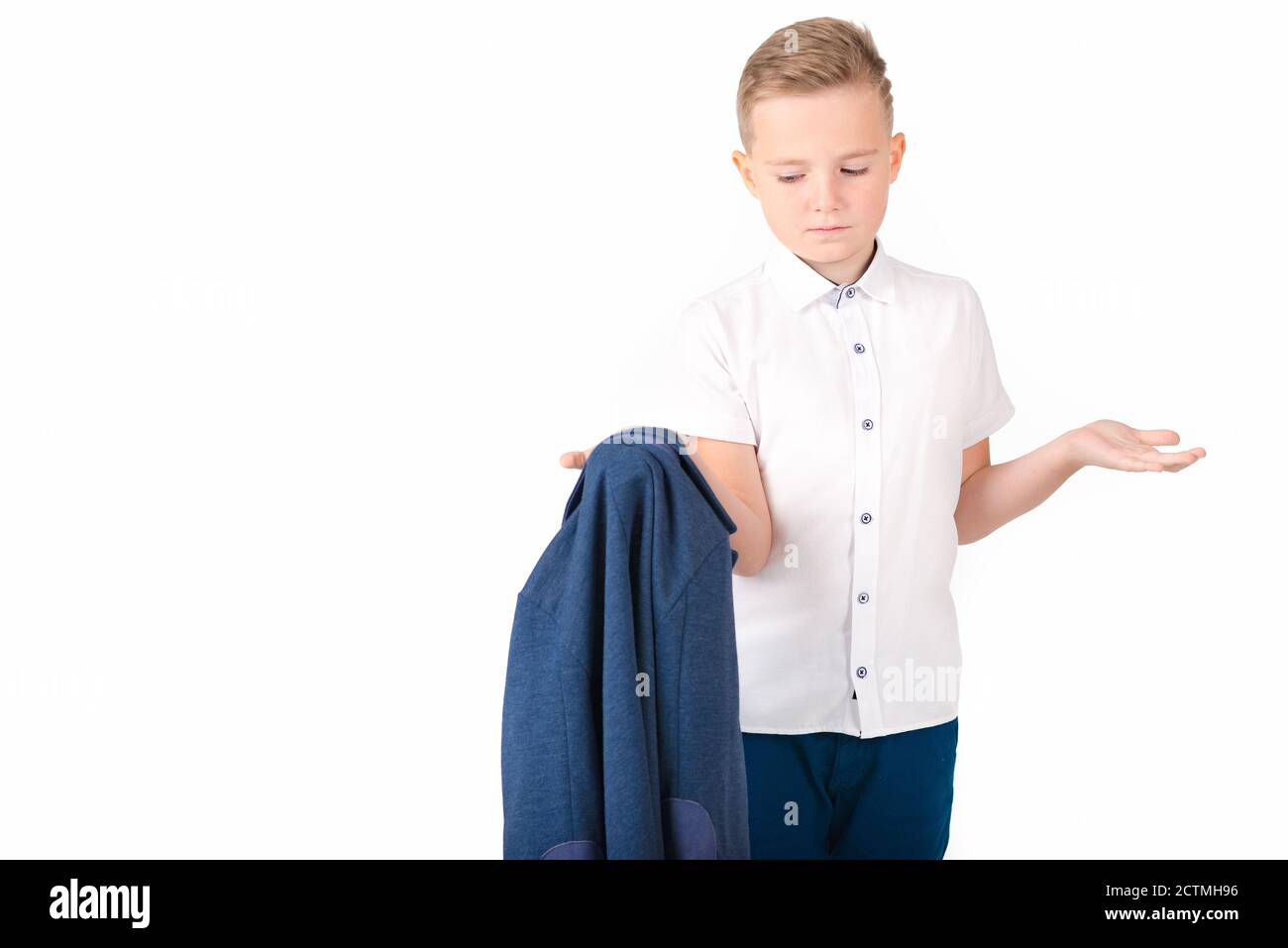 Front view portrait of disappointed student holds the school suit ...