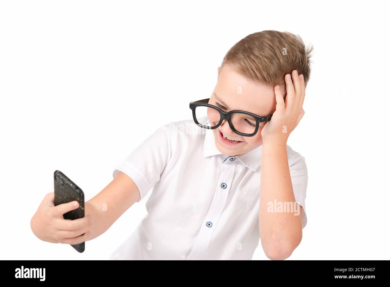 Banner Portrait of smiling boy with glasses using mobile phone on ...