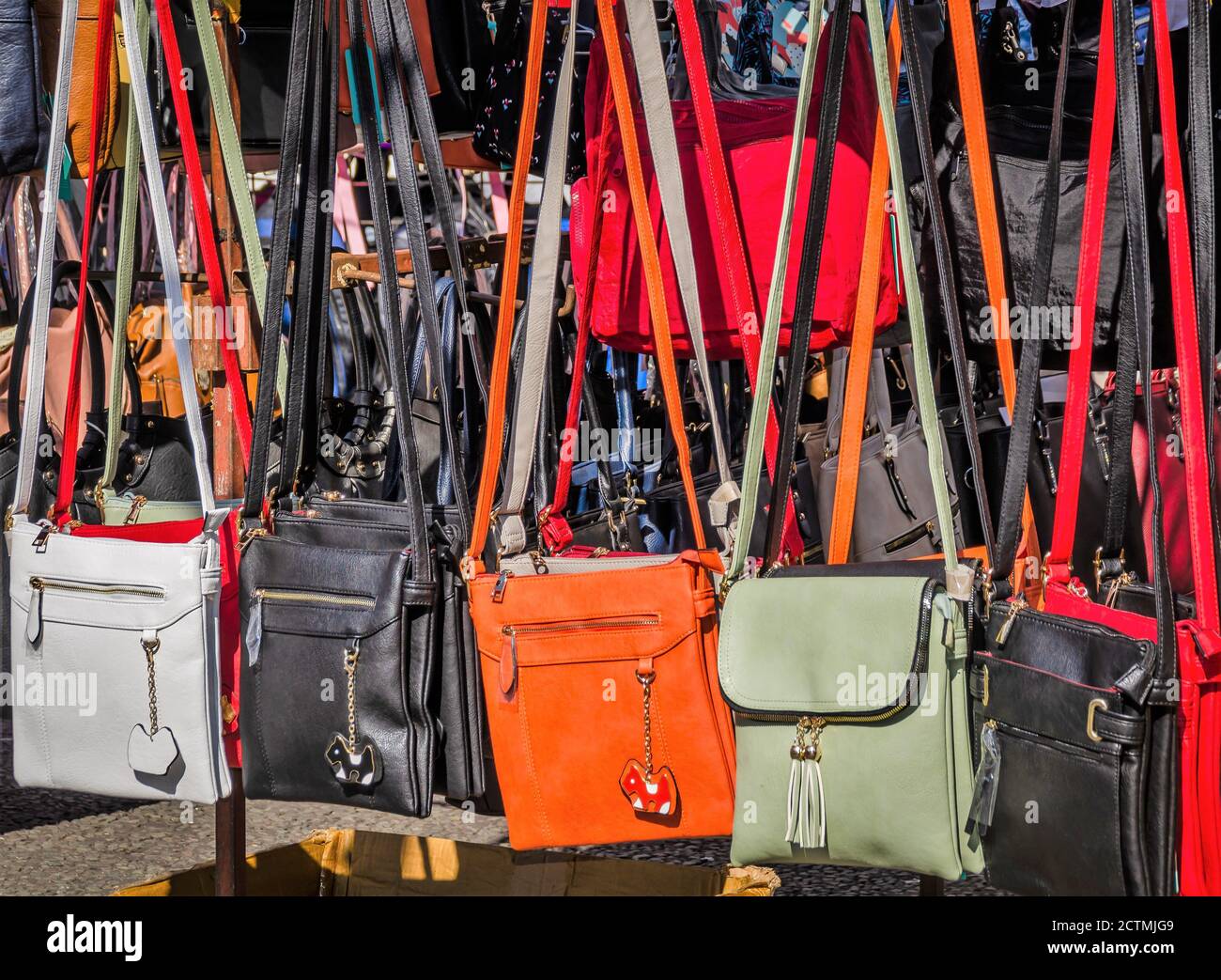 market stall selling shoulder bags Stock Photo - Alamy