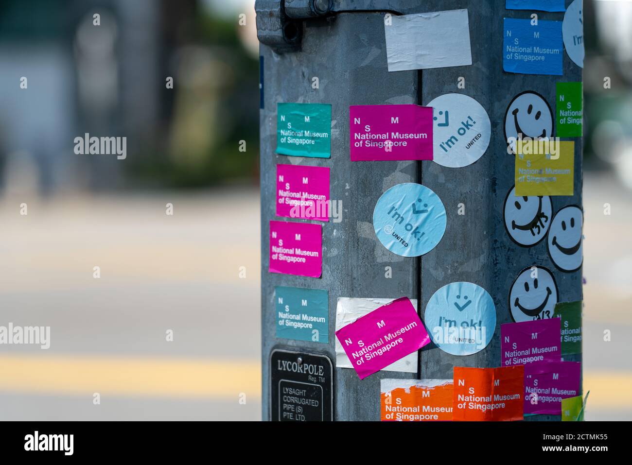 SINGAPORE, SINGAPORE - Sep 10, 2020: Stickers on lamp post, smiley face ...