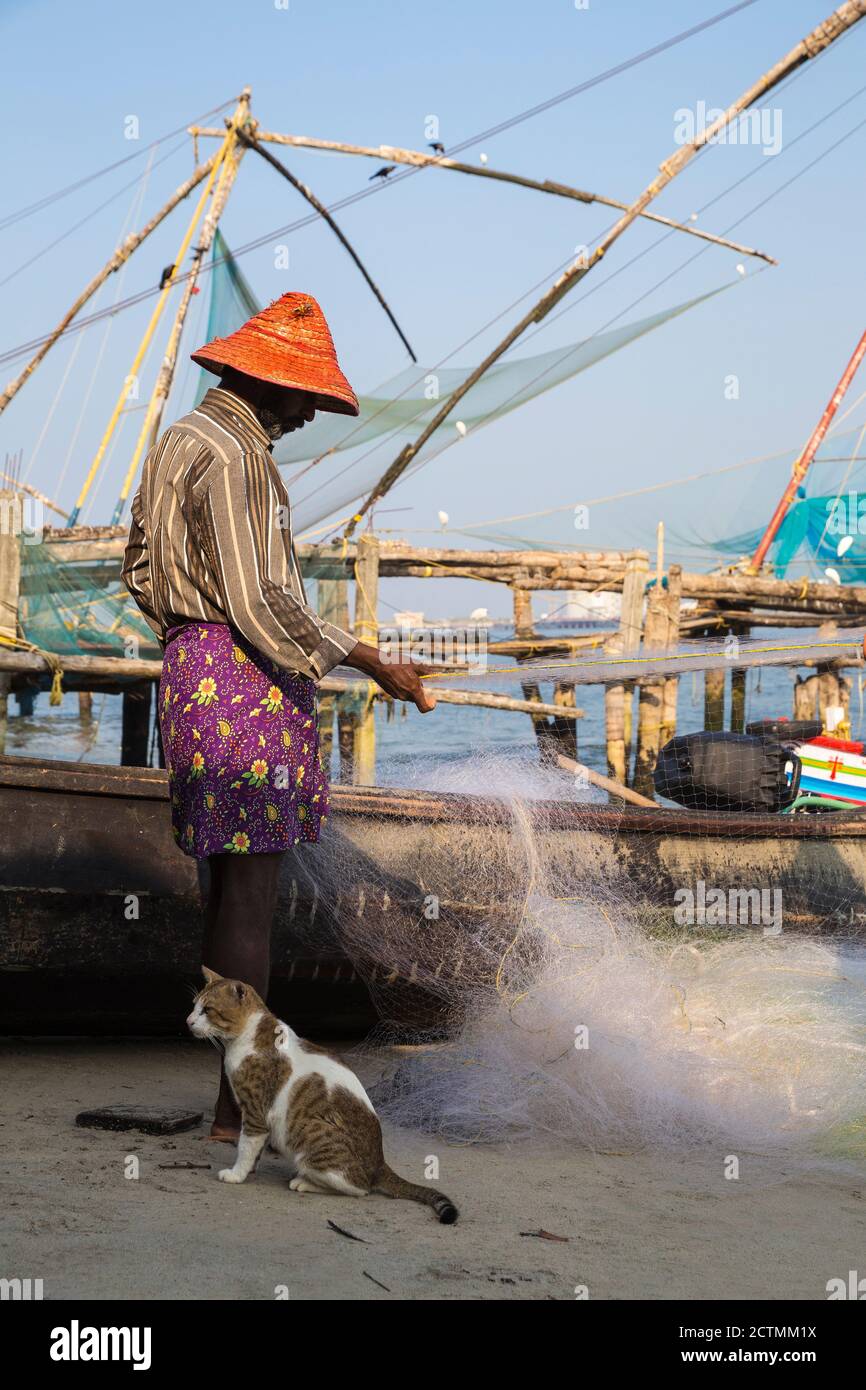 India, Kerala, Cochin - Kochi, Fort Kochi, Fisherman sorting fishing ...