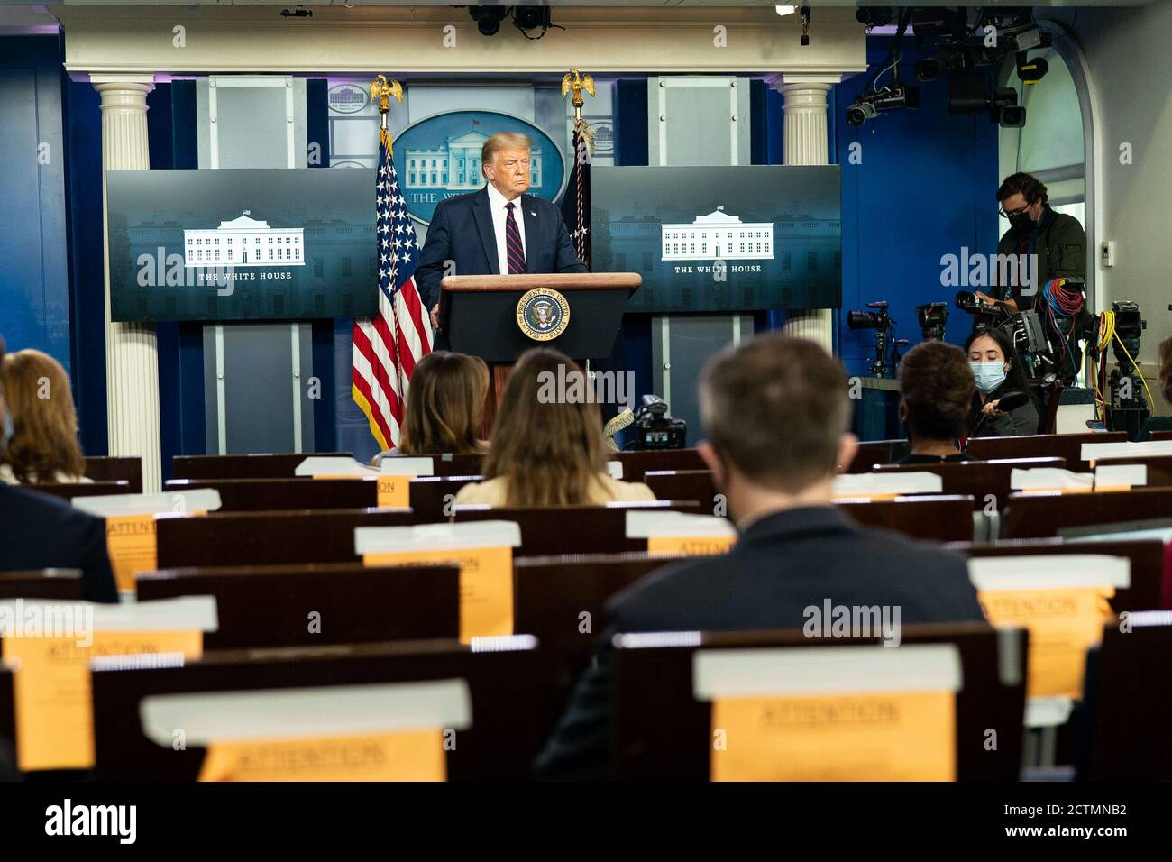 President Trump listens to a reporter's question during a press ...
