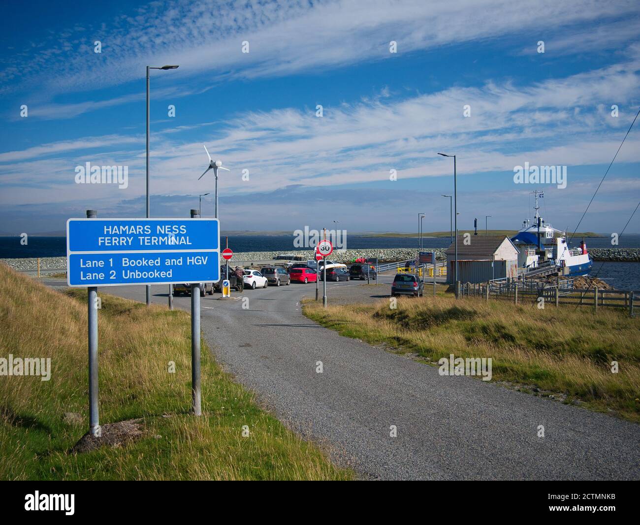 Cars and passengers wait to board an inter island ferry at the Hamars ...