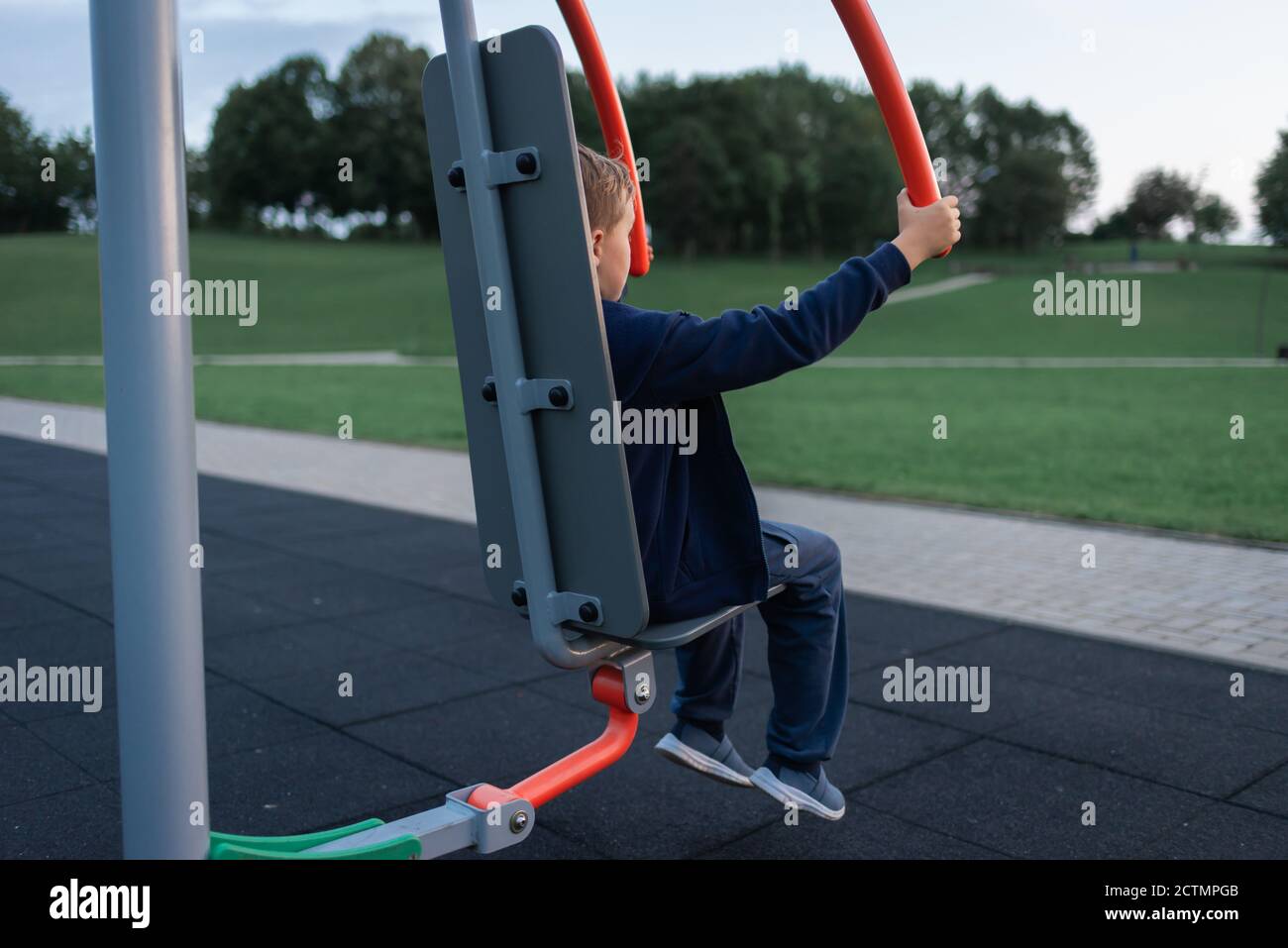 Street workout equipment outdoor sport fitness and bodybuilding. Boy in ...