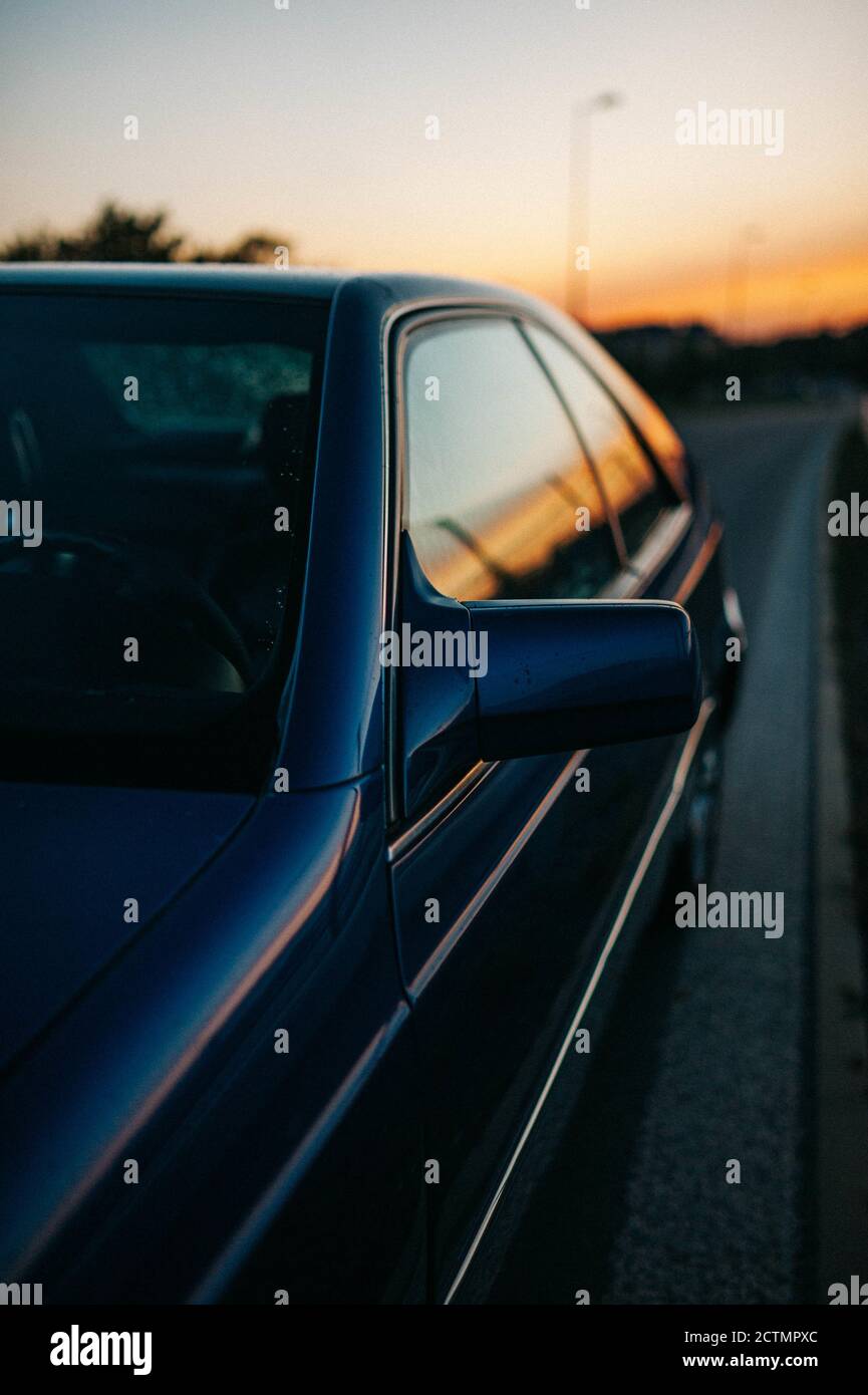Car with the sunset sky reflecting in the windows Stock Photo - Alamy