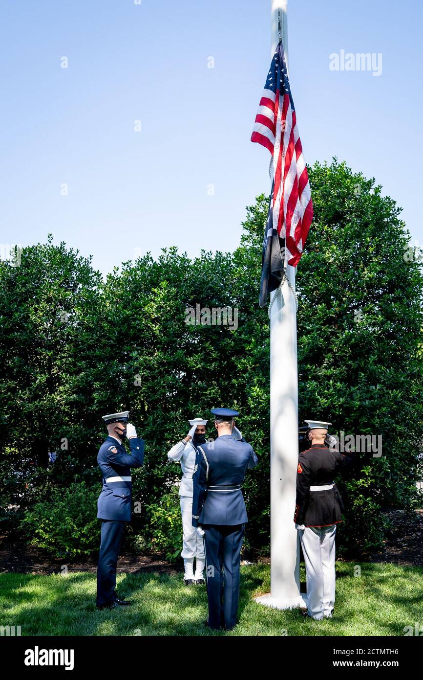 Flag Raising Ceremony. Members of the U.S. Military raise the American ...