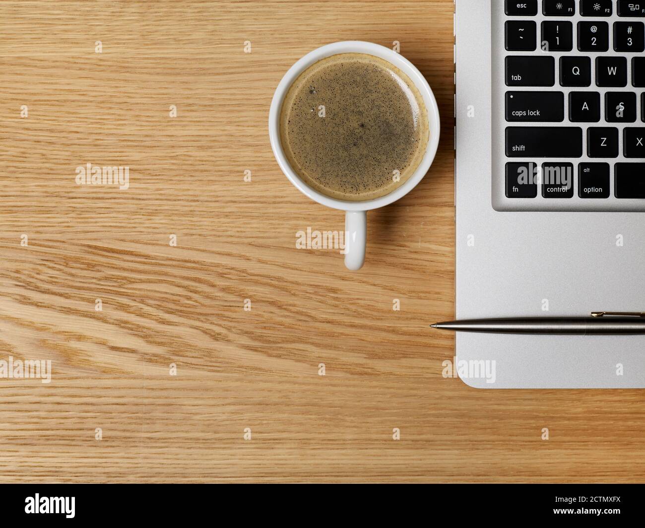 Coffee and laptop on desk Stock Photo - Alamy