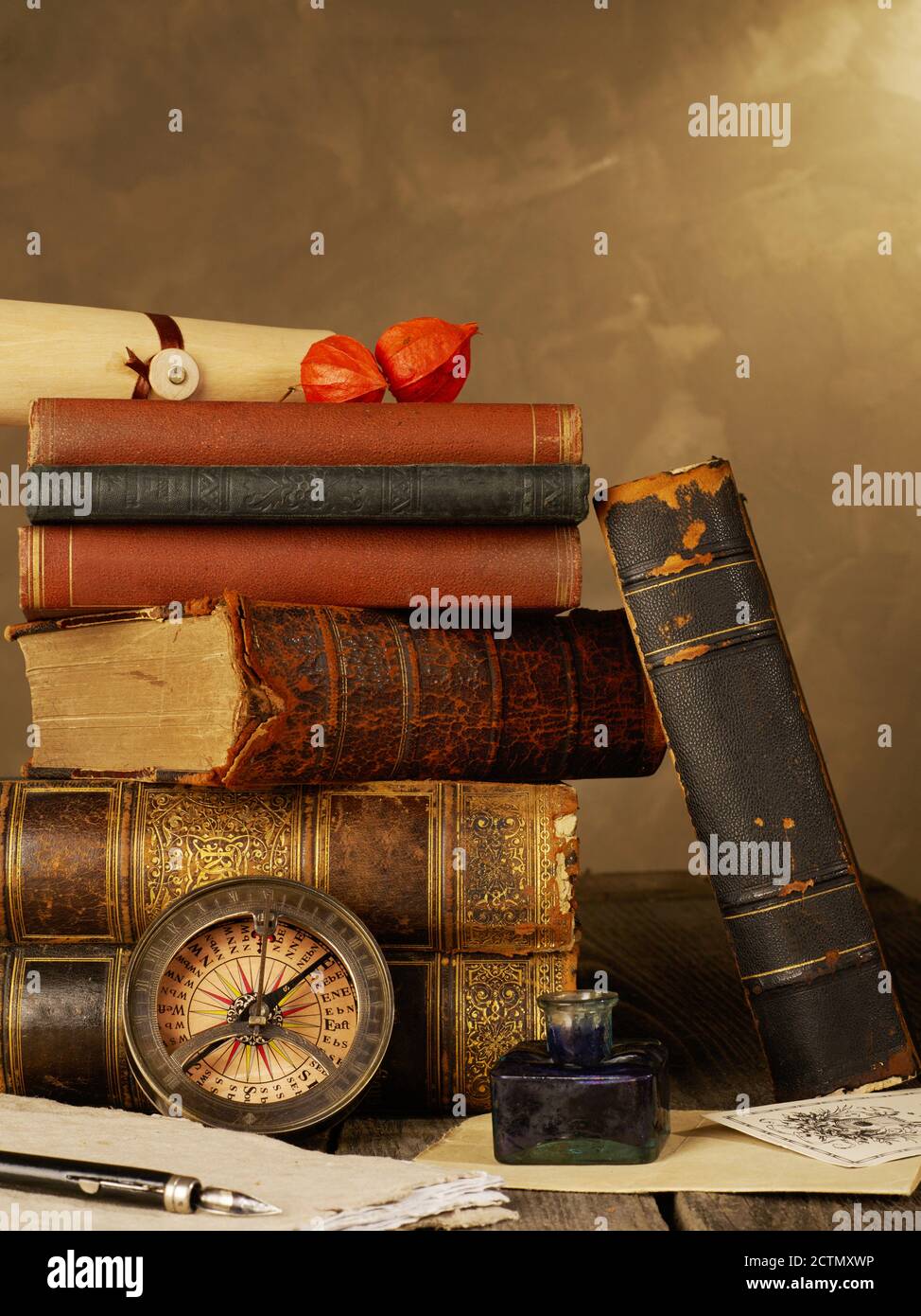 Old books and writing instruments Stock Photo - Alamy