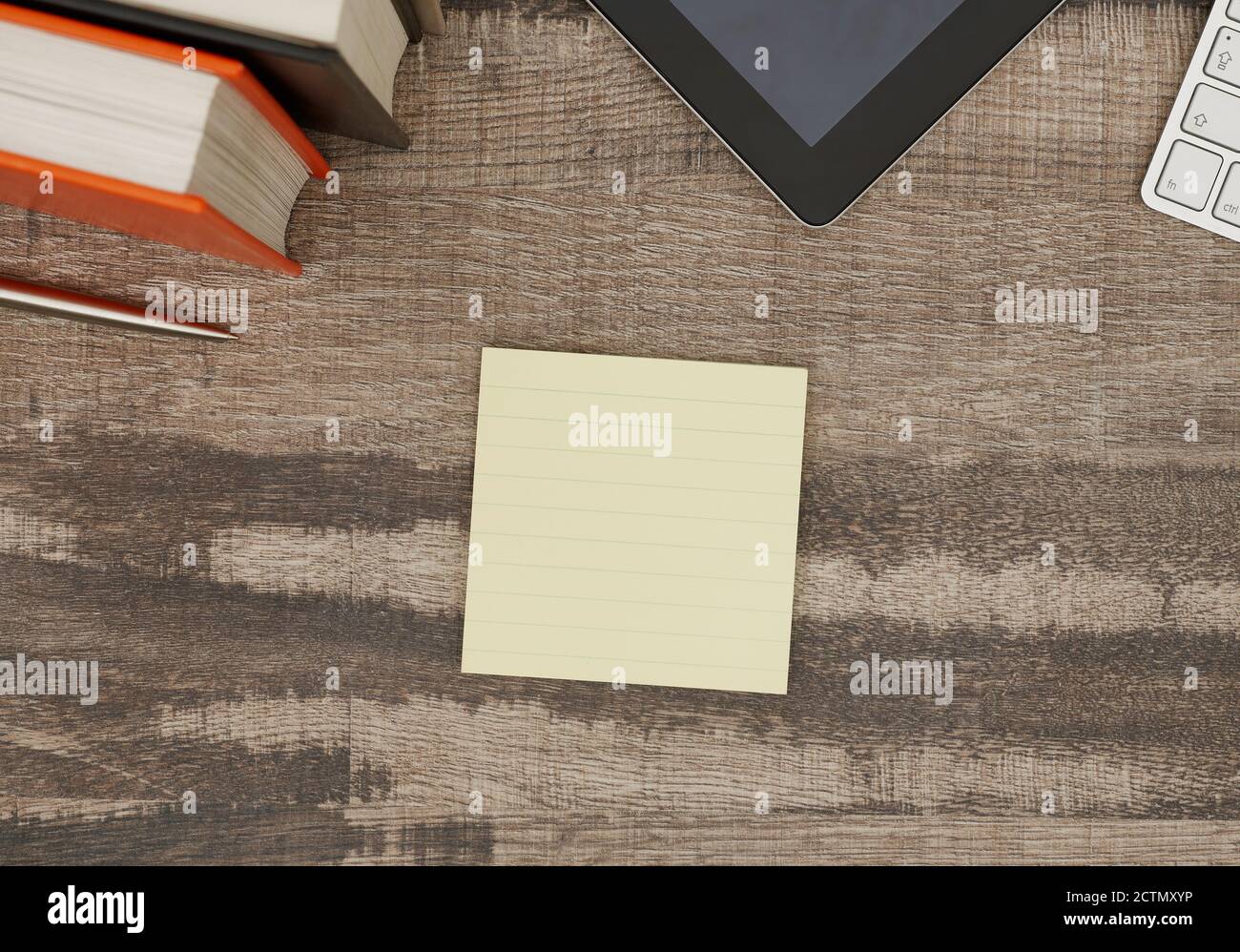 Blank adhesive note on wooden desk Stock Photo - Alamy