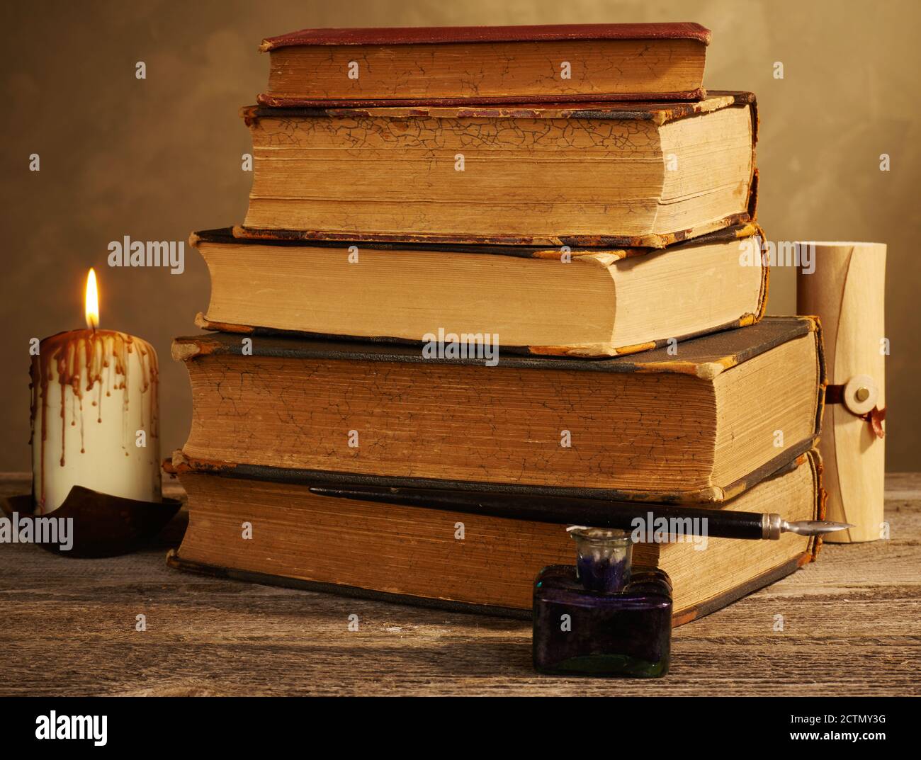 Old books and writing instruments Stock Photo - Alamy