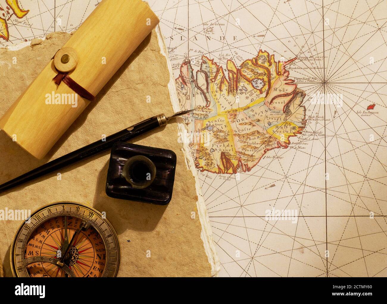 Captain's journal and compass over old map from XVIII century Stock ...