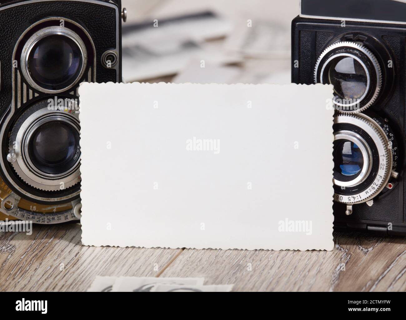 Old blank photo and camera Stock Photo - Alamy