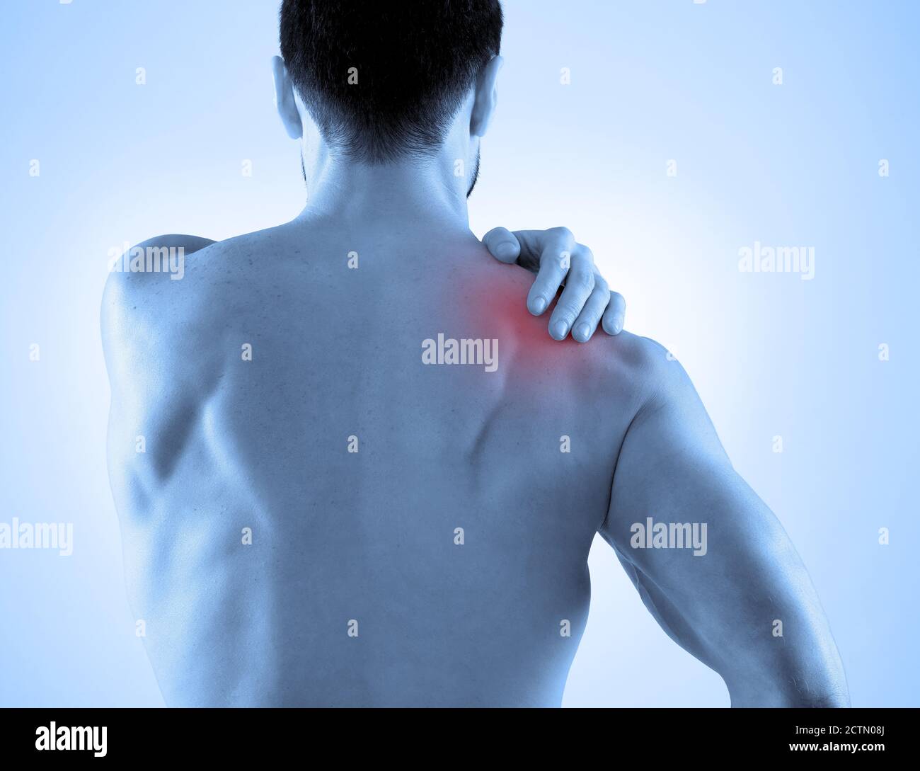 Man holding his sore shoulder Stock Photo - Alamy