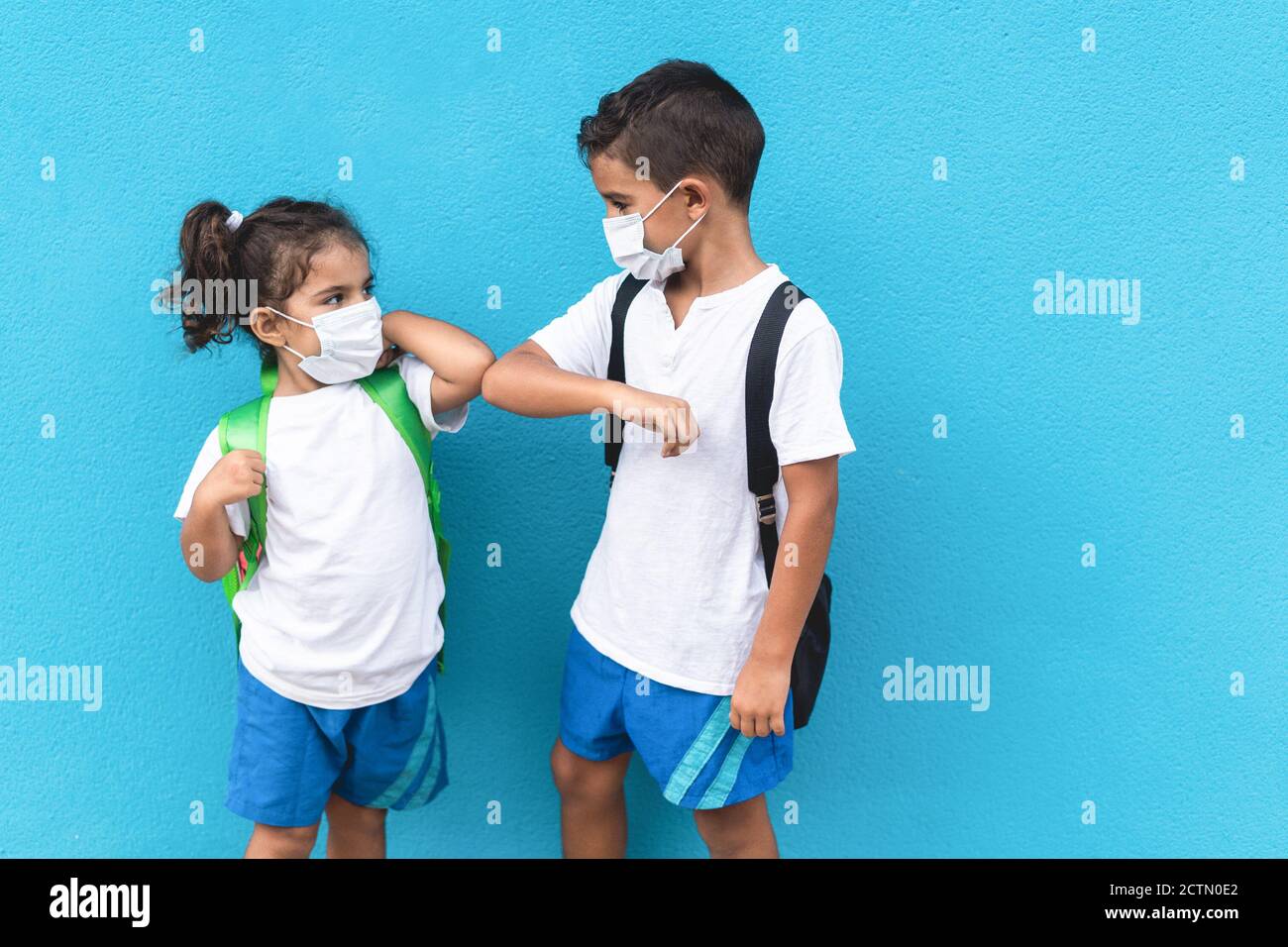 Children bump their elbows instead of greeting with a hug - Avoid the ...