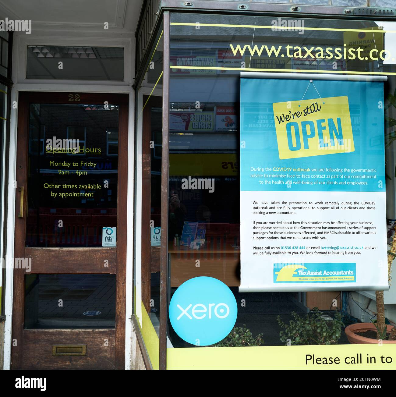 'We are still open' notice on the window of a shop at Kettering ...