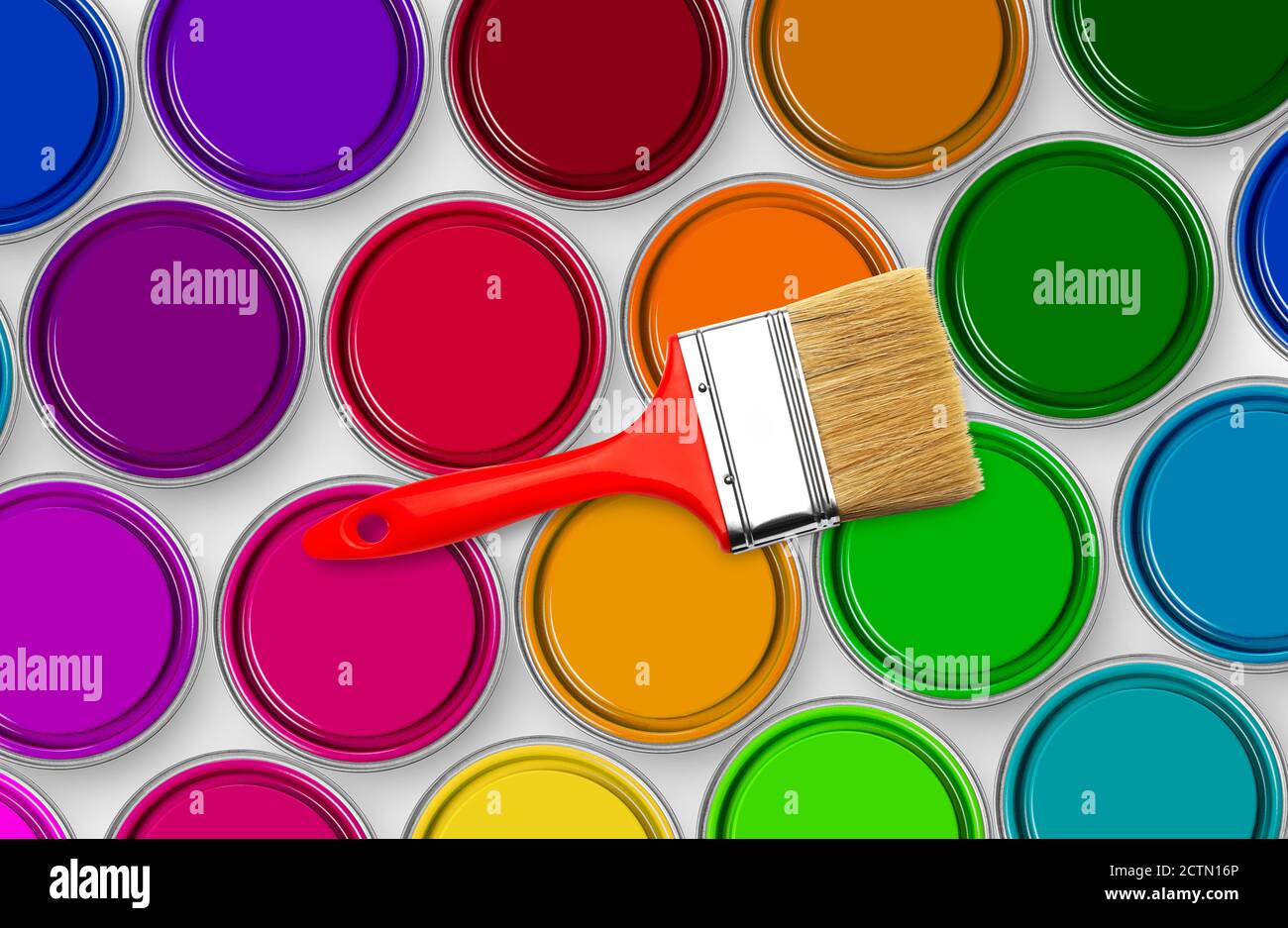 Paint brush on multicolored paint tins, aerial view Stock Photo - Alamy