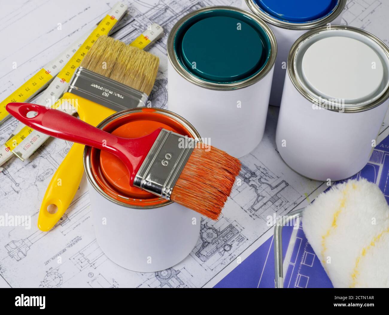 Painting tools on blueprints Stock Photo - Alamy