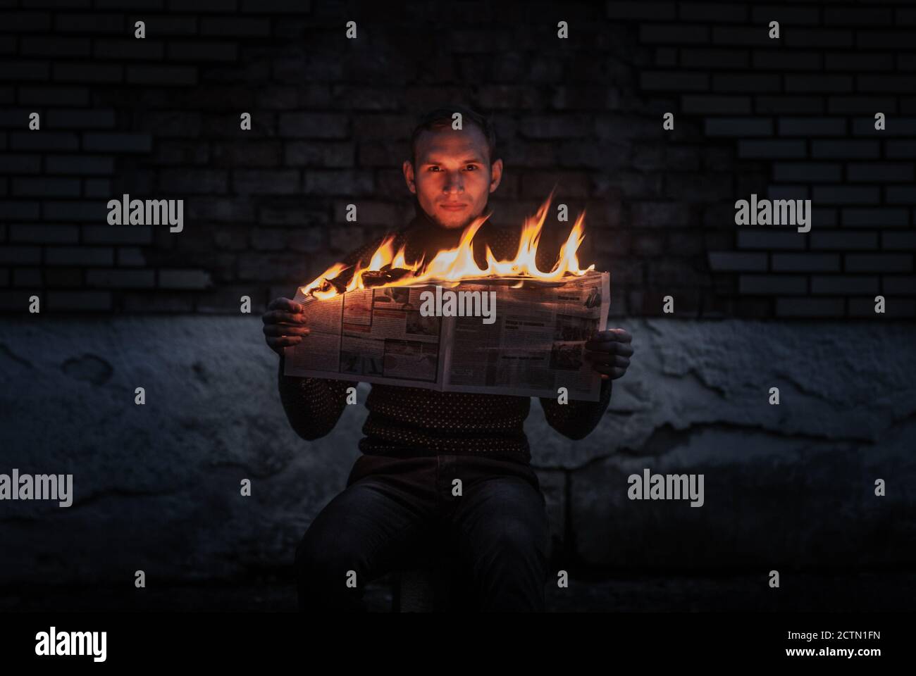 Fire on newspaper hi-res stock photography and images - Alamy