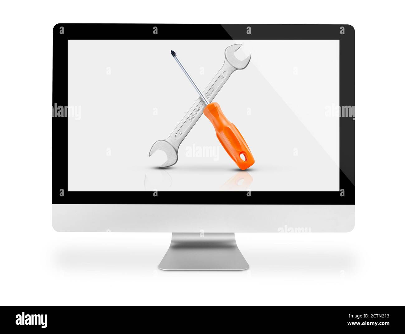 Screwdriver and wrench on computer, isolated on white Stock Photo - Alamy