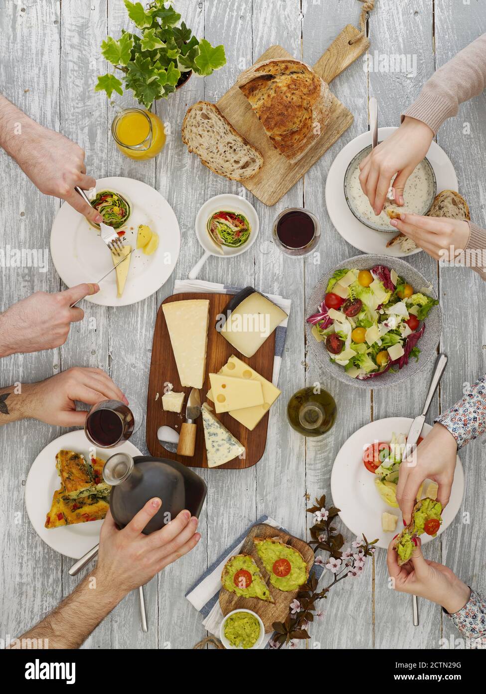 People eating at table Stock Photo - Alamy