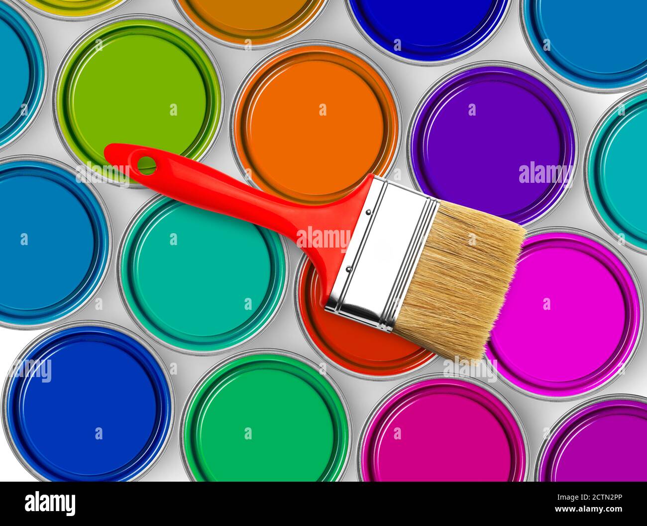 Paintbrush on multicolored paint tins, aerial view Stock Photo - Alamy