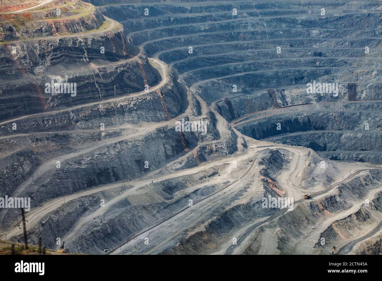 Open pit mining raw minerals for steel production. Giant iron ore ...