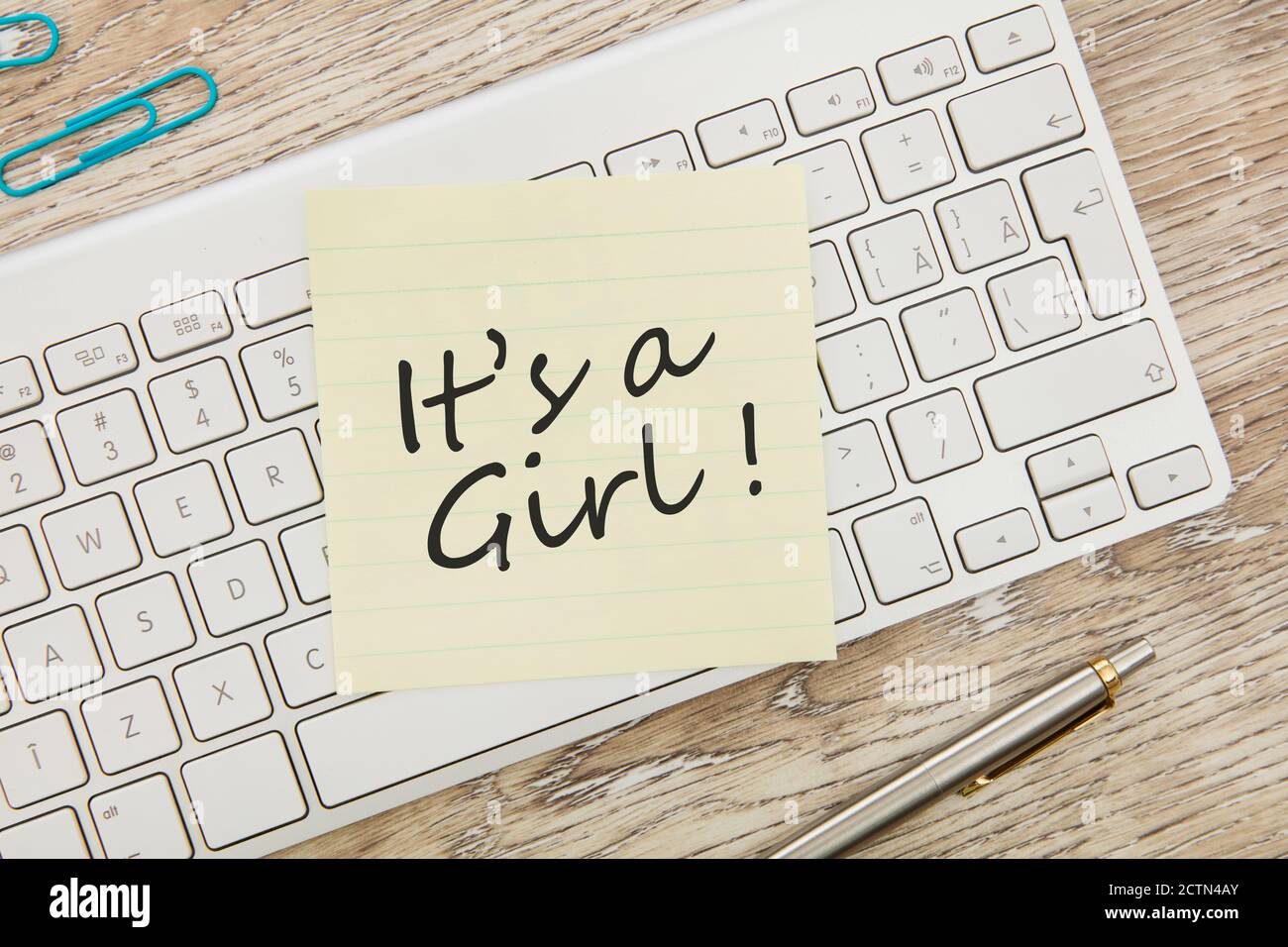 It's a girl message on adhesive note Stock Photo - Alamy