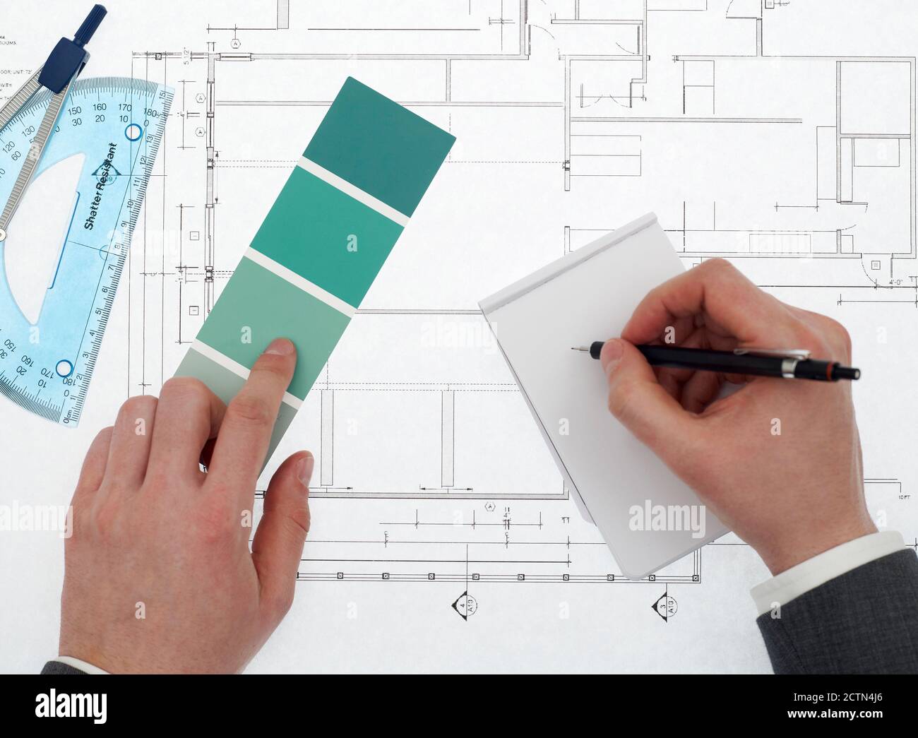 Man with color swatch and notebook Stock Photo - Alamy