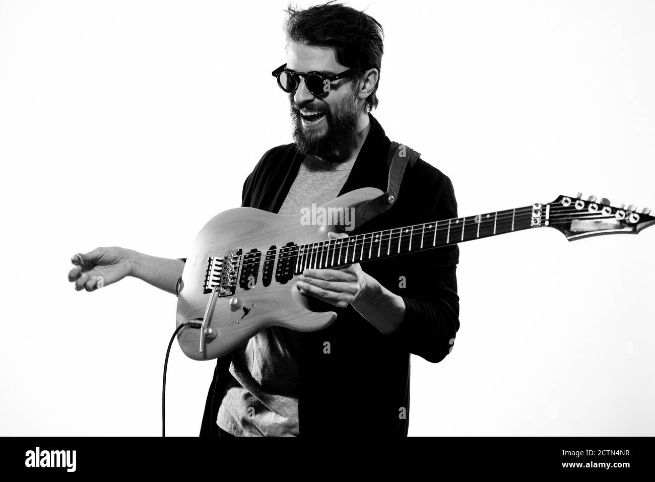 man with guitar in hands musician rock star performance lifestyle light ...