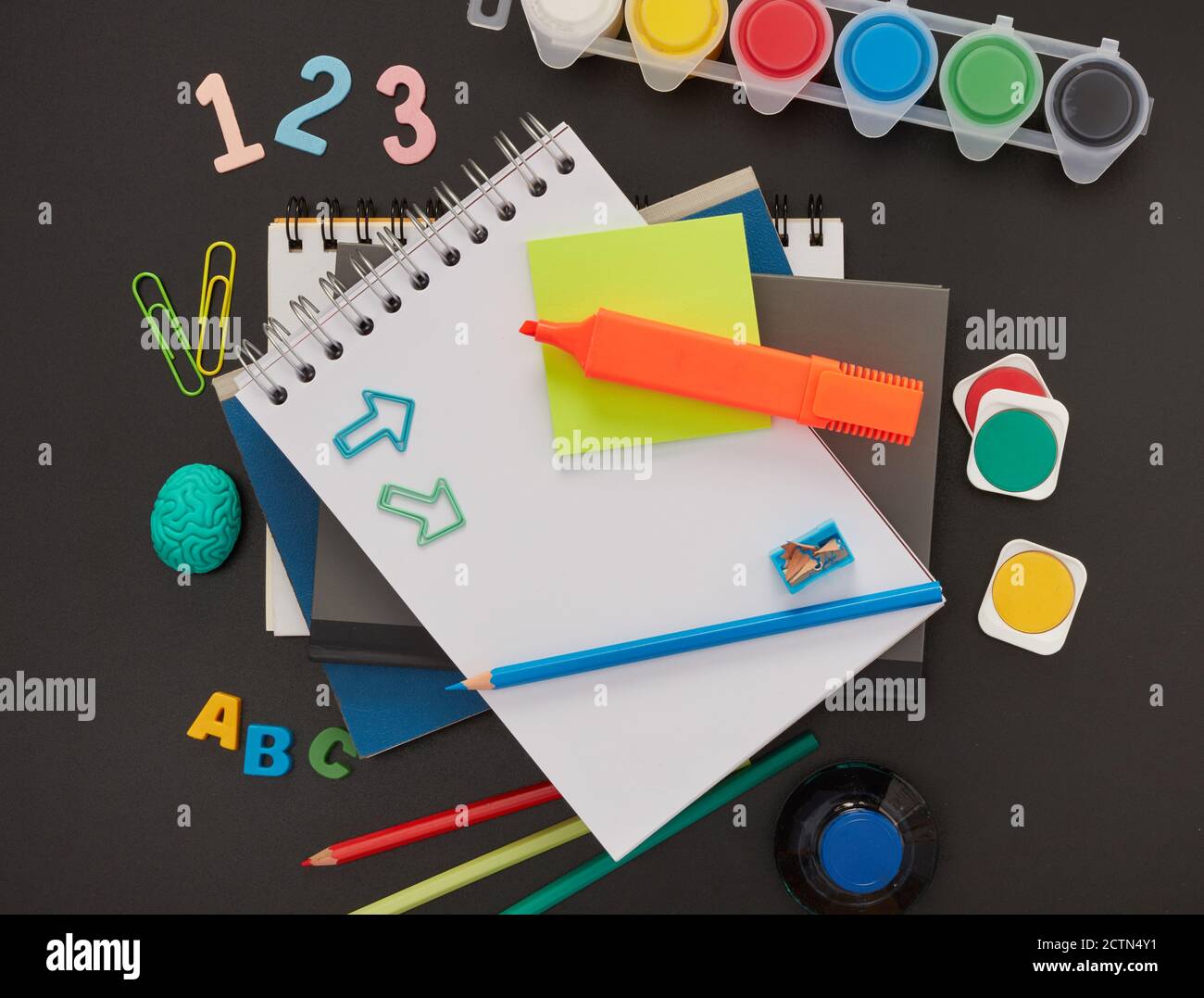 Notebook and multi-colored school supplies Stock Photo - Alamy