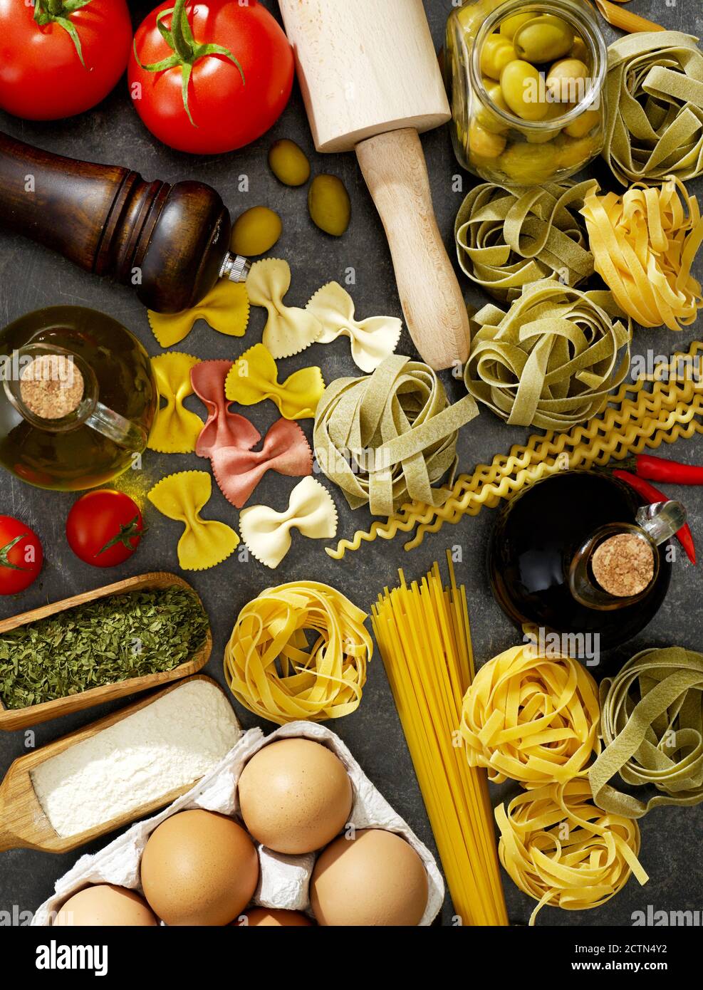 Raw pasta on kitchen counter top Stock Photo - Alamy