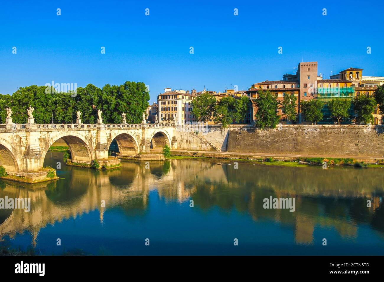View on the Sant Angelo bridge over the Tiber river in Rome, Italy on a sunny day Stock Photo ...