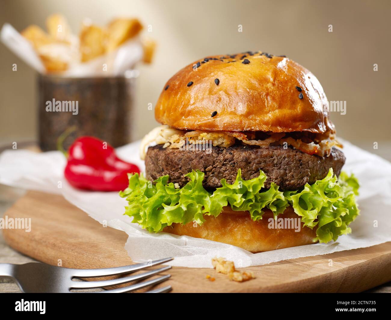 Rustic burger with fries Stock Photo - Alamy