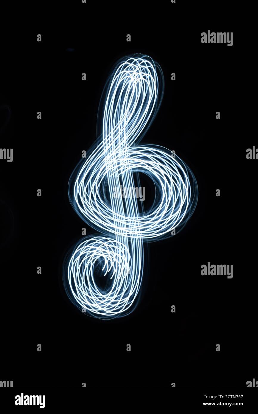 Illustration of a clef in white color lights on a black background ...