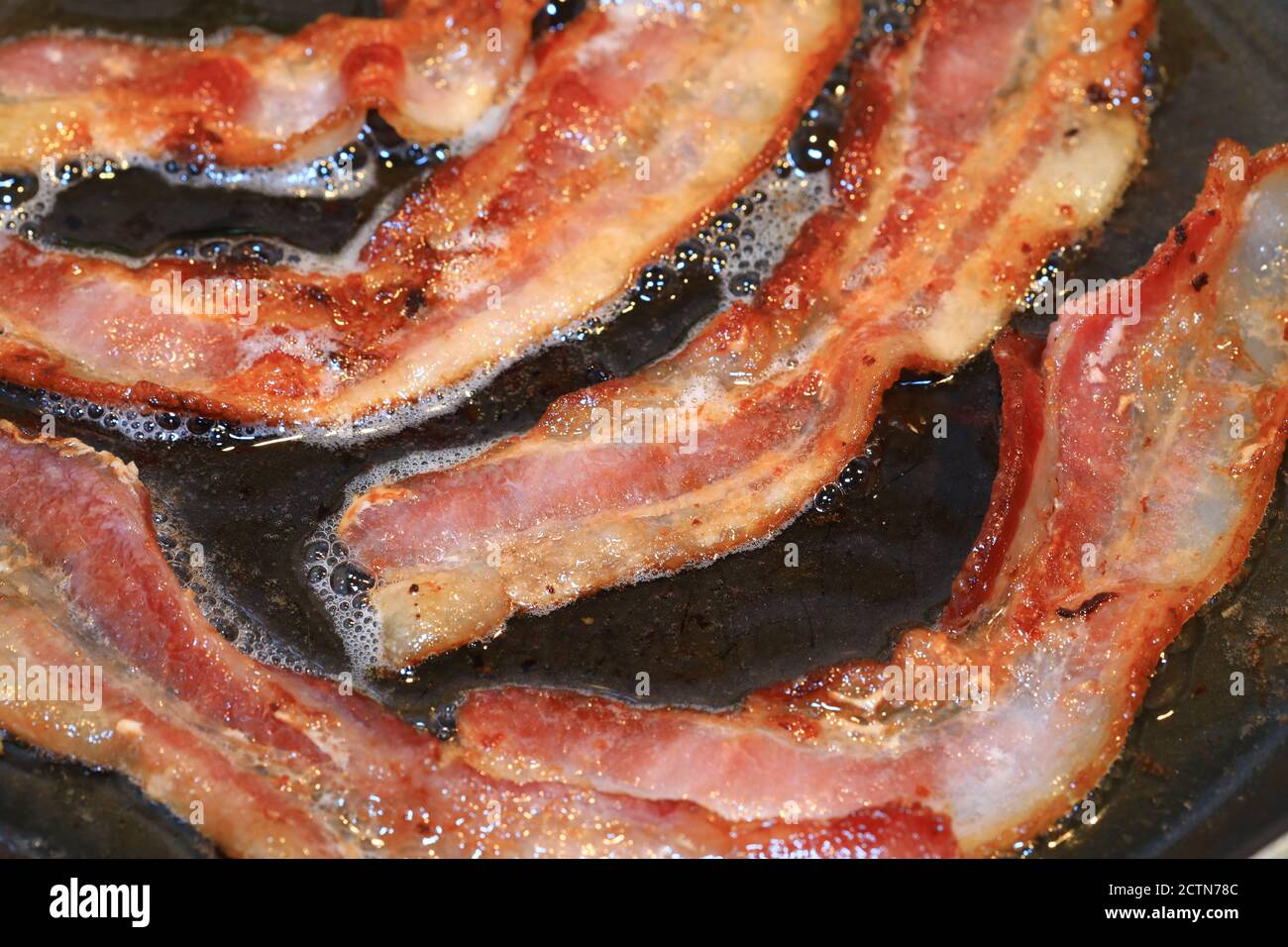 Sizzling Bacon Strips Stock Photo - Alamy
