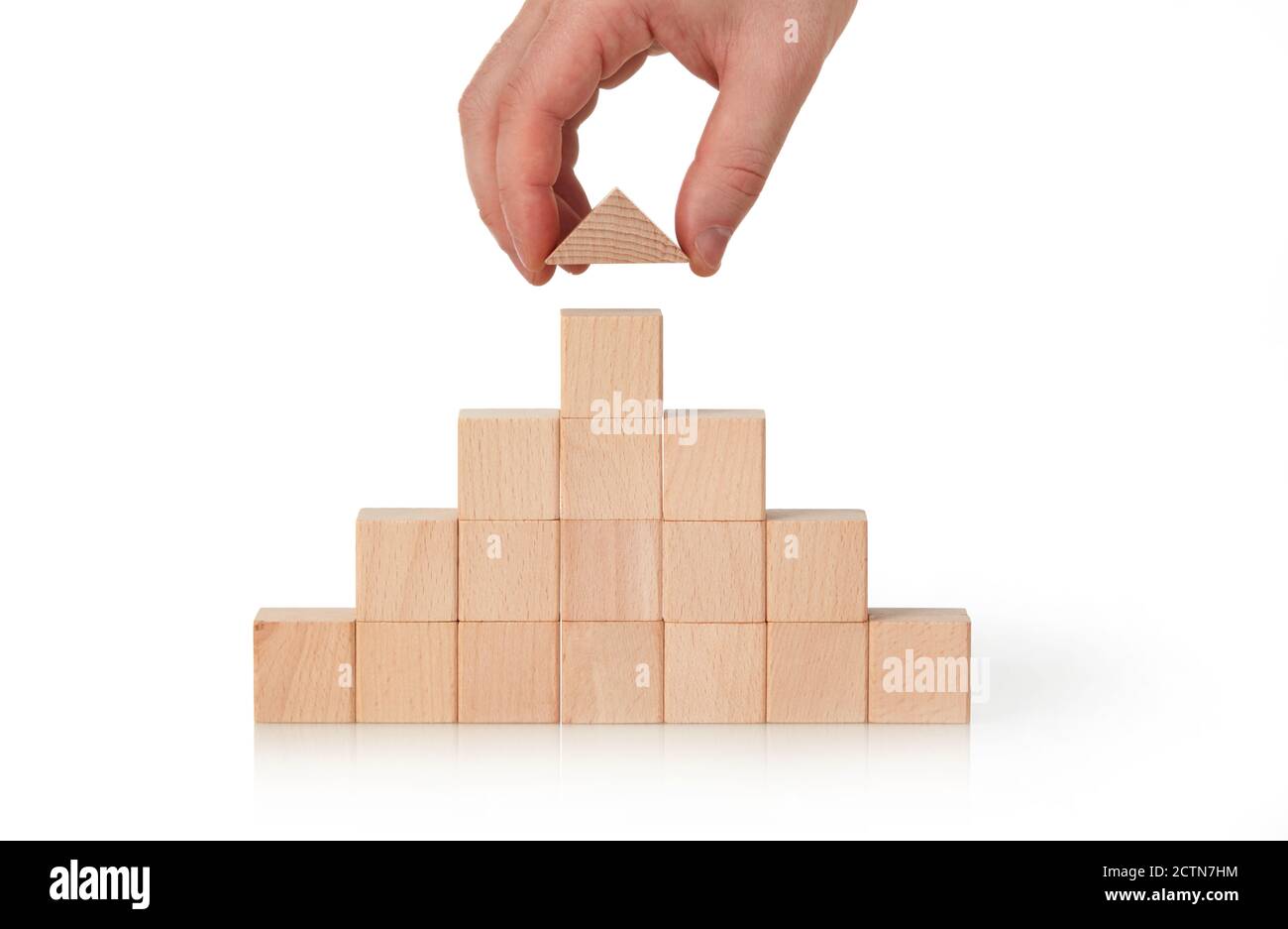 Wooden blocks pyramid, white background Stock Photo - Alamy
