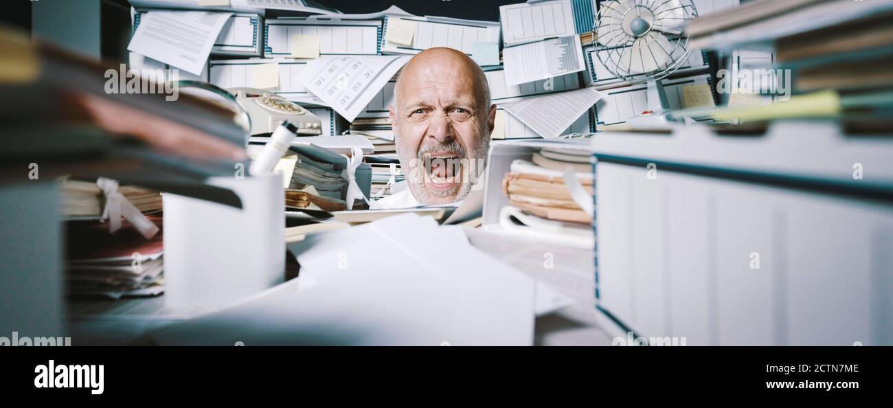 Buried in paperwork hi-res stock photography and images - Alamy