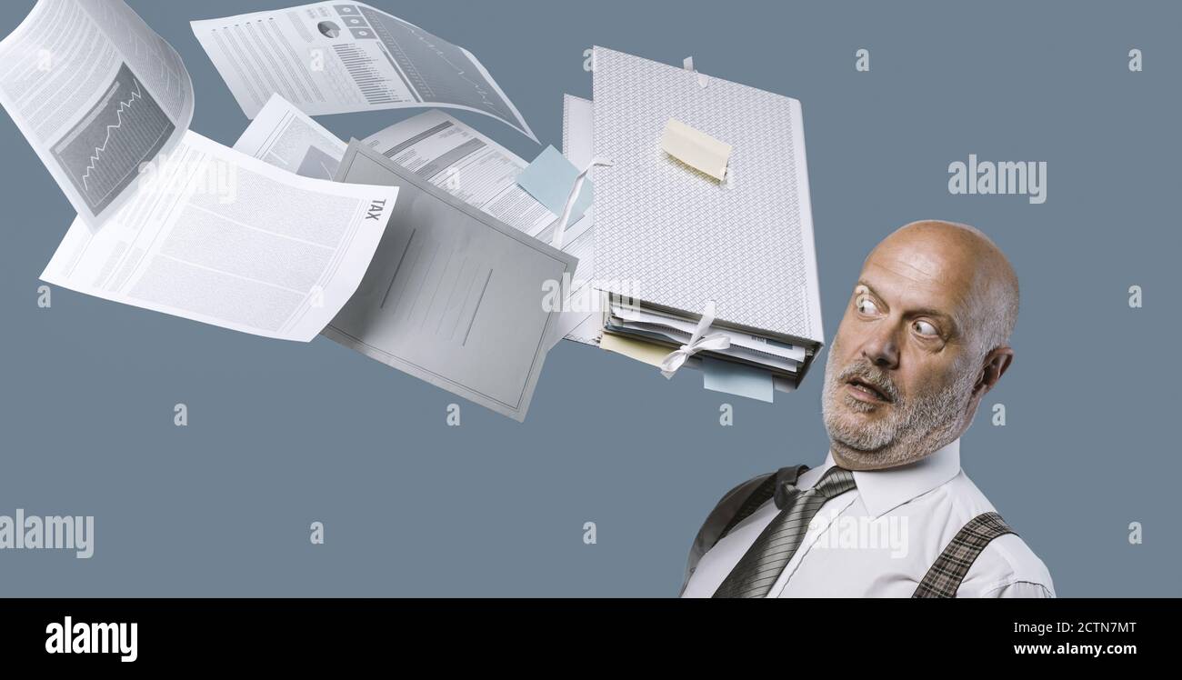Flying paperwork hitting and hurting a businessman's head, unexpected ...