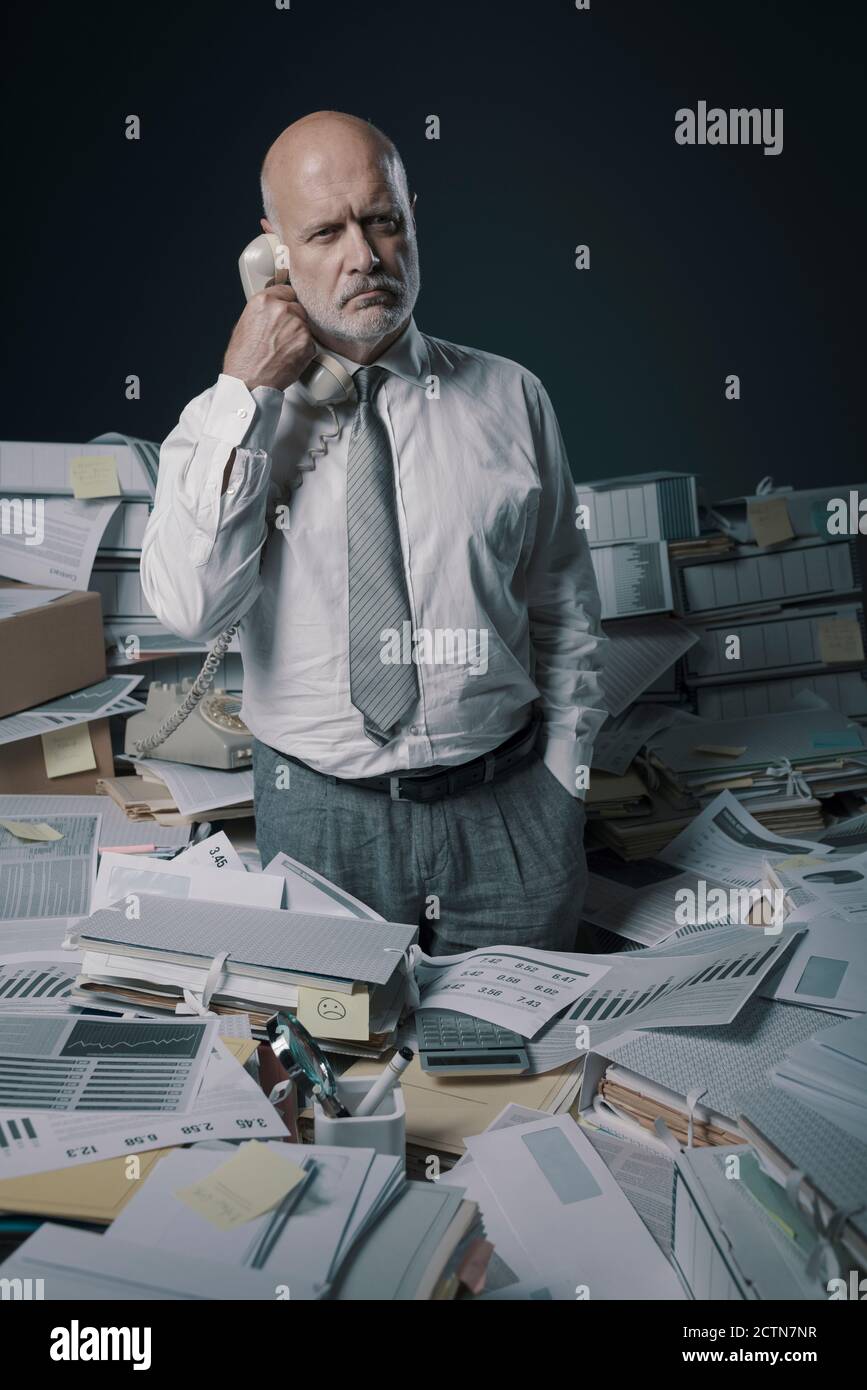 Office worker surrounded files hi-res stock photography and images - Alamy