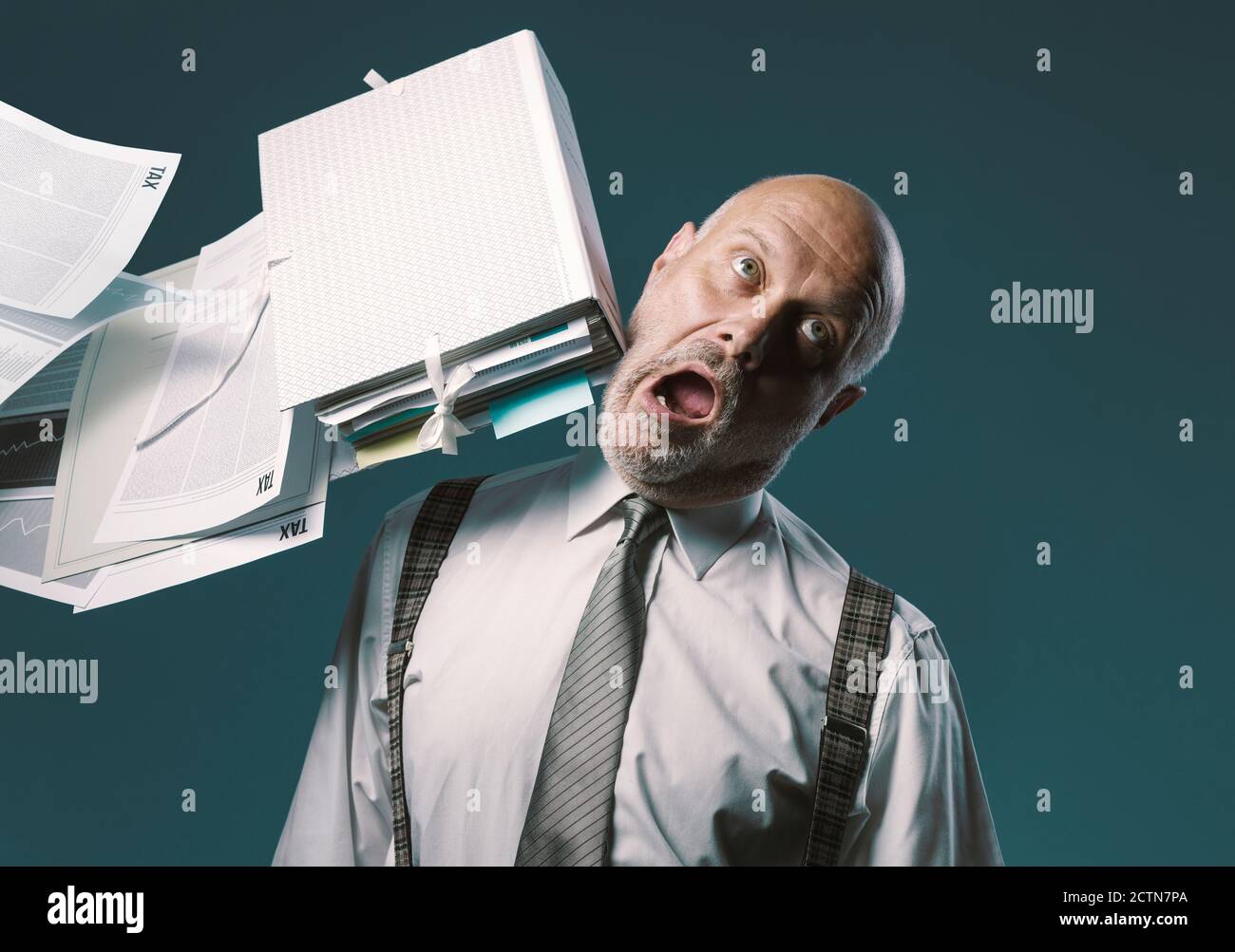 Flying paperwork hitting and hurting a businessman's head, unexpected ...