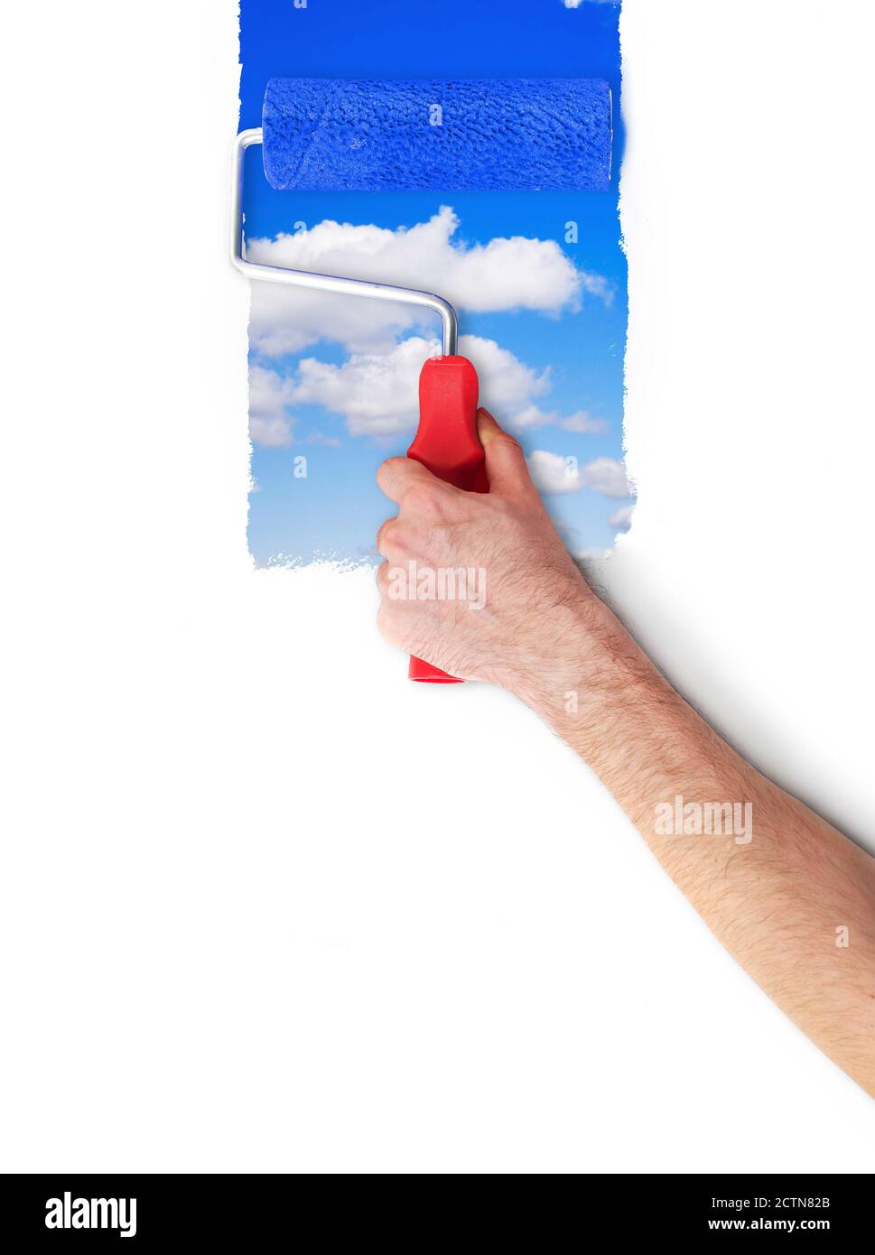 Hand with paintbrush painting the wall with sky texture, isolated on ...