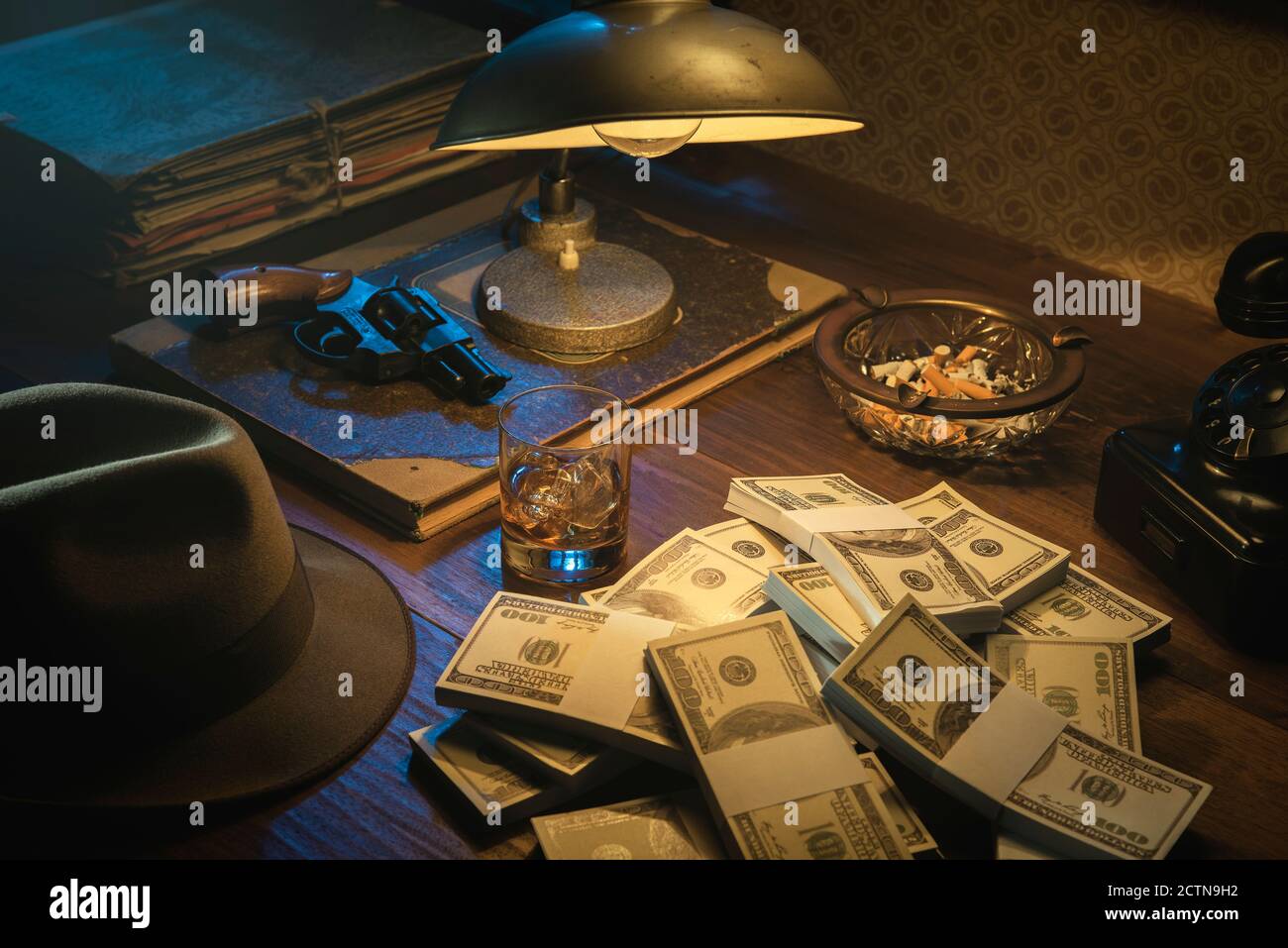 1950s film noir style desktop with revolver and cash money: crime ...