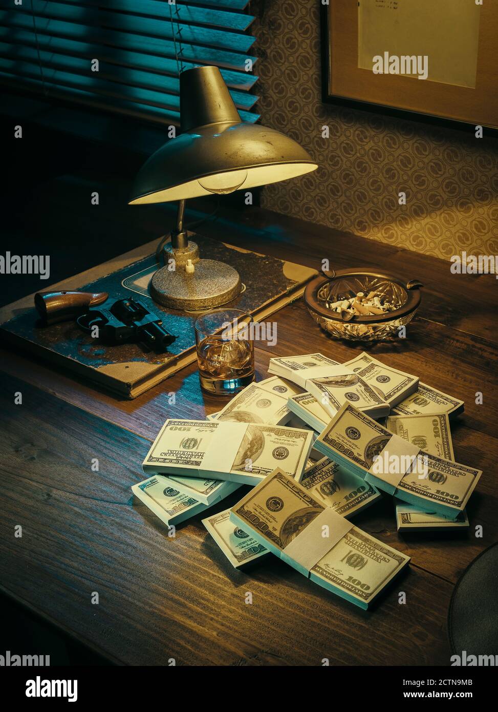 1950s film noir style desktop with revolver and cash money: crime ...