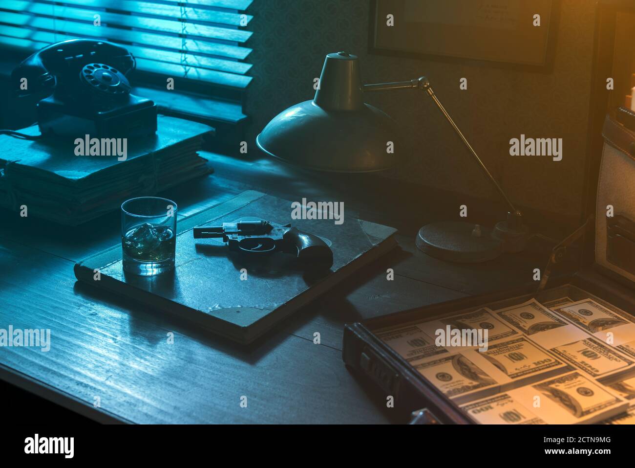 Vintage film noir style desktop with revolver, drink and open briefcase ...