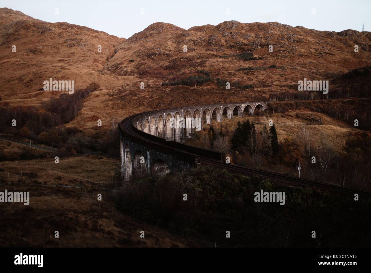 Breathtaking scenery of winding Glenfinnan Viaduct leading through ...