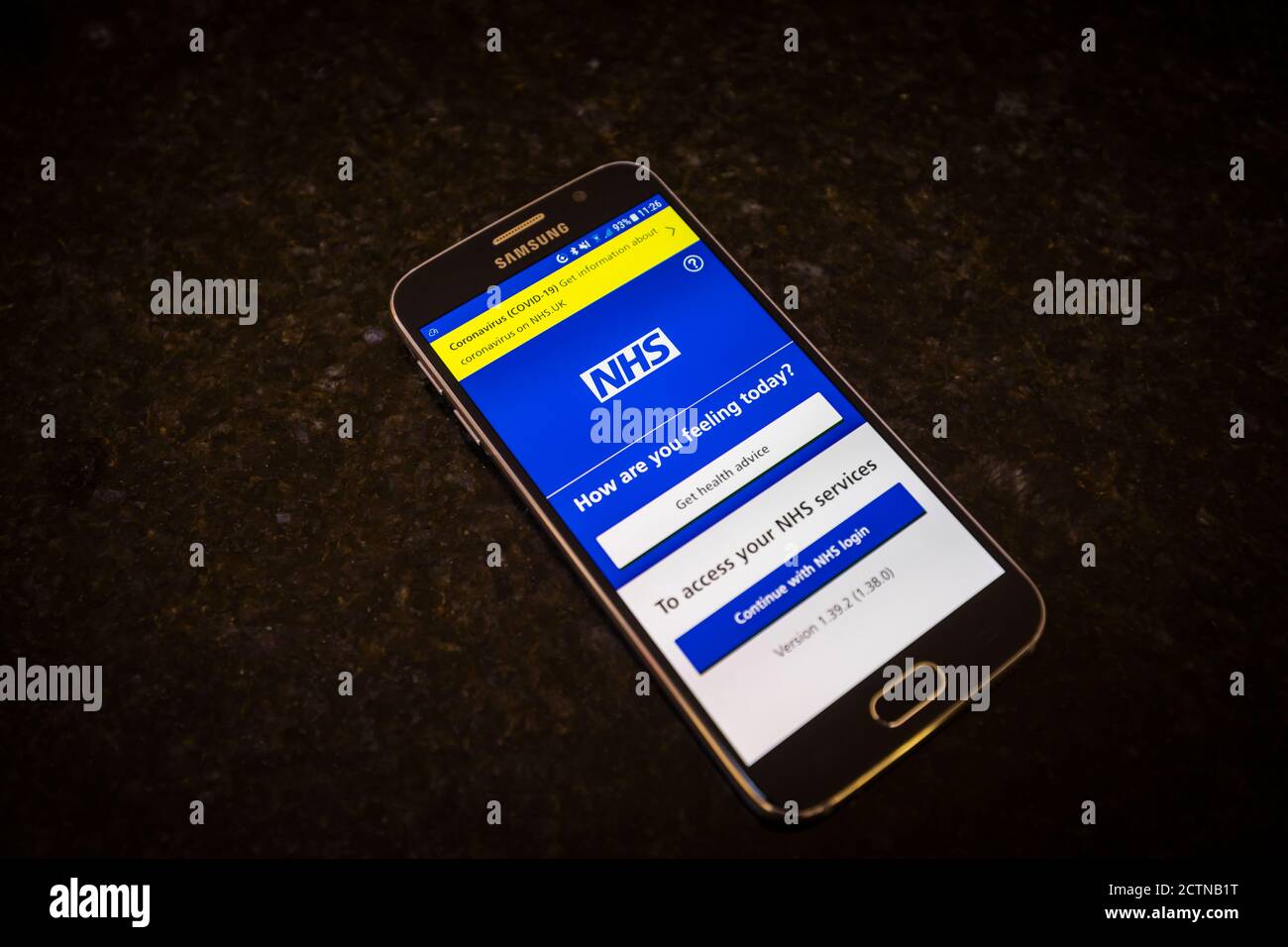 The NHS Track and Trace app home screen seen on the screen of an ...